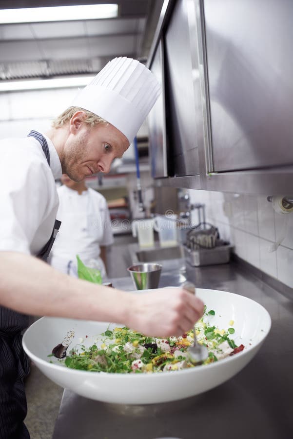 Preparing the Starters. Chefs Preparing a Meal Service in a ...