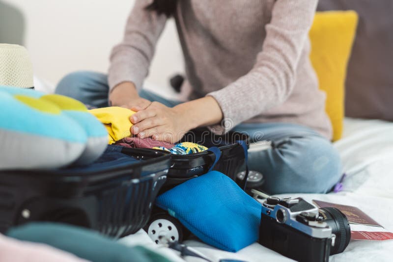 Preparing Suitcase for Summer Vacation Trip. Young Woman Checking ...
