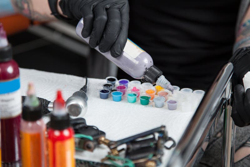 Tattoo Master Preparing Ink Stock Image - Image of tattooing, pouring ...