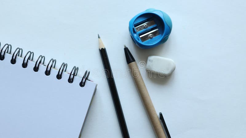 Preparing To Work and Study Notepad Pencil Pen Sharpener and Rubber on ...