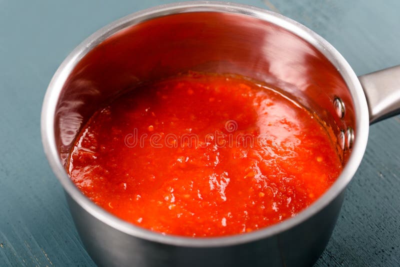Preparing Tomato Sauce in Pot Stock Photo - Image of small, metallic ...
