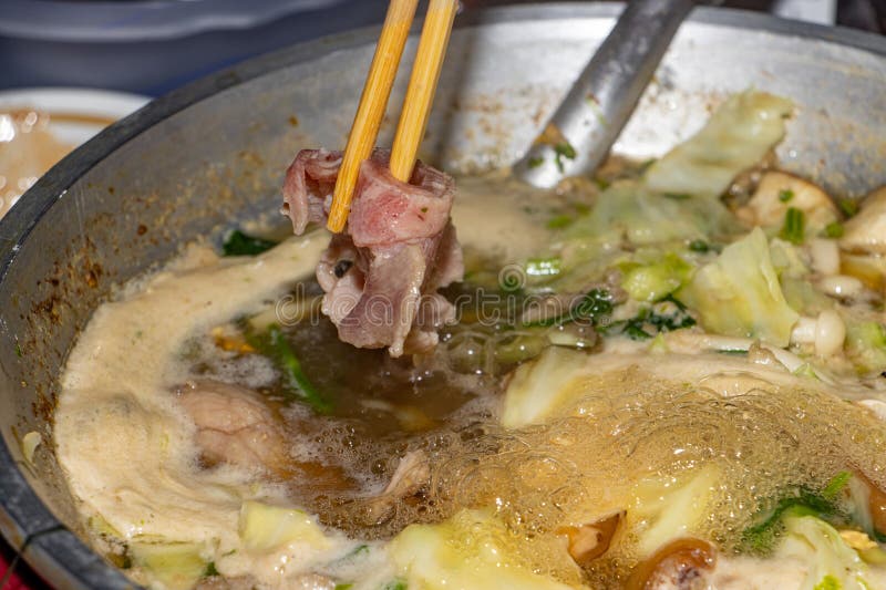 Preparing Traditional Suki Soup by Cooking in a Pot Stock Photo - Image ...