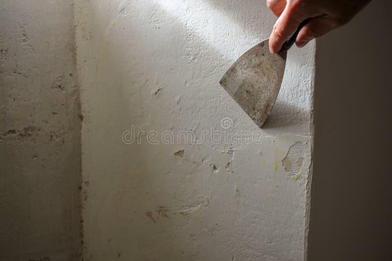 Preparing the Wall with a Spatula To Paint it Stock Image - Image of ...