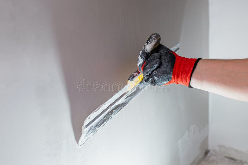 Leveling the Walls with White Putty Stock Image - Image of craftsman ...