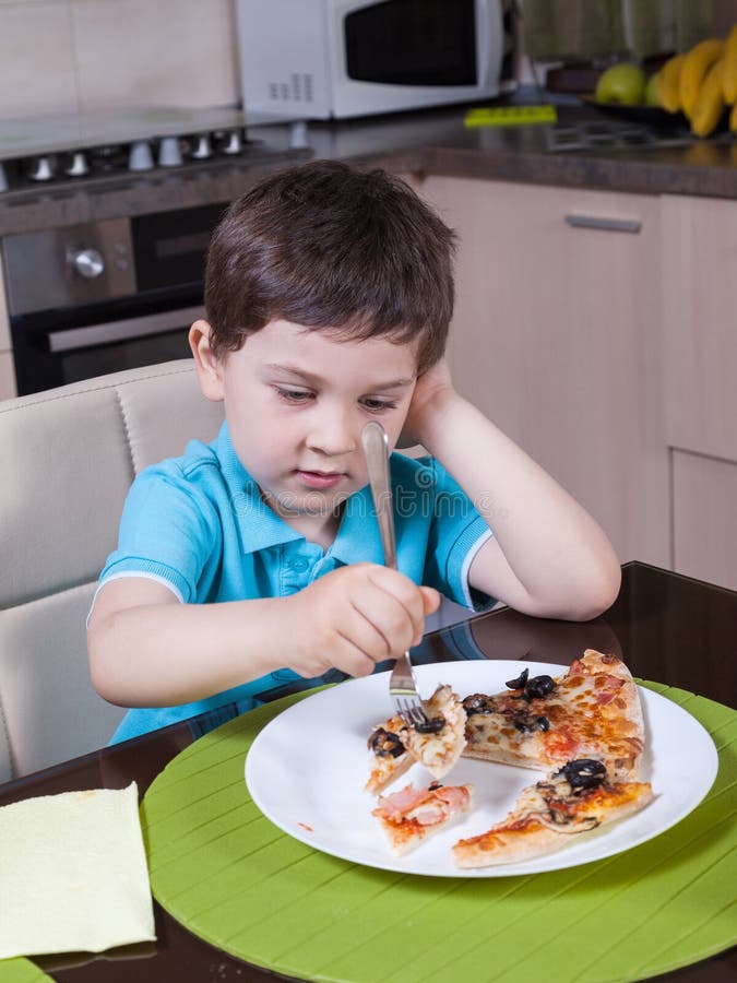 Preschool boy eat pizza stock image. Image of appetizing - 54308711