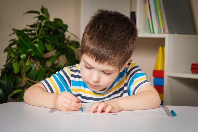 Preschool Child Learns To Write, Writes Copybook. Stock Photo - Image ...