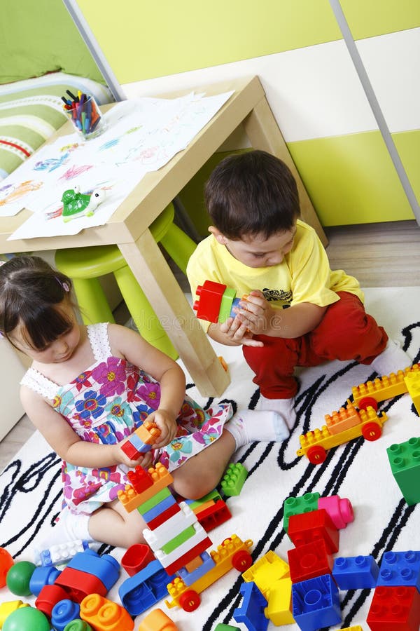 The Little Boy Who Build Towers with Plastic Cubes Stock Image - Image ...