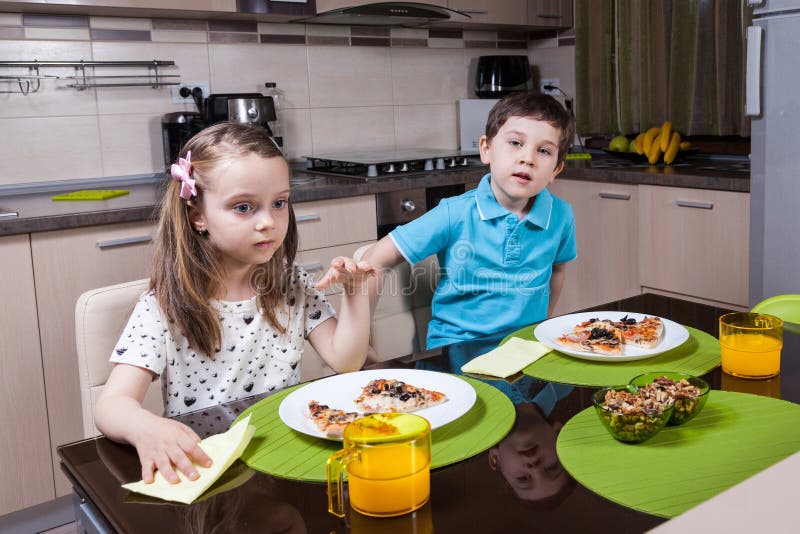 Two Preschool Children Who Eat Healthy Food in the Kitchen Stock Photo ...