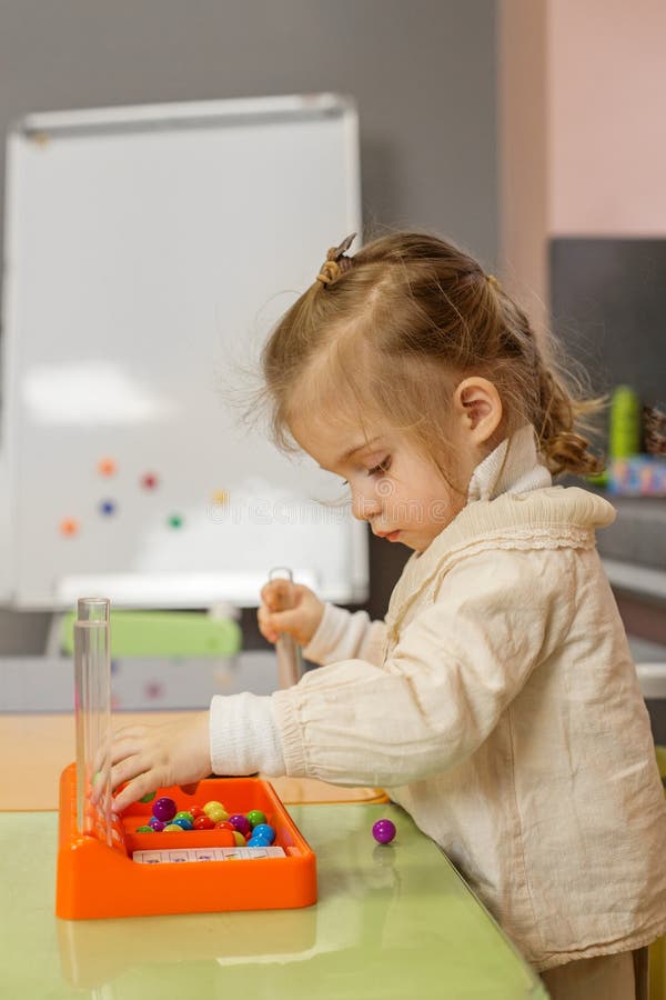 Little Child Concentrated on Bead Sorting Activity Stock Image - Image ...