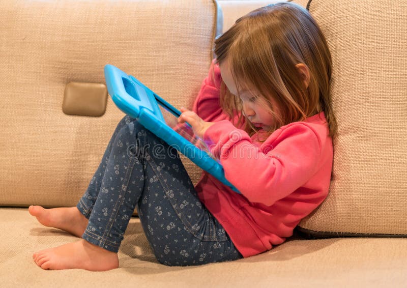 Preschool Girl Using a Tablet Computer at Home Stock Photo - Image of ...