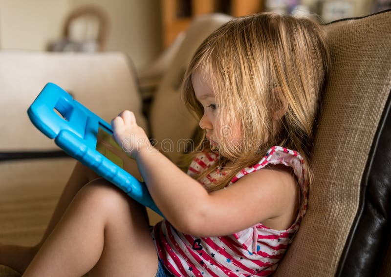 Preschool Girl Using a Tablet Computer at Home Stock Photo - Image of ...