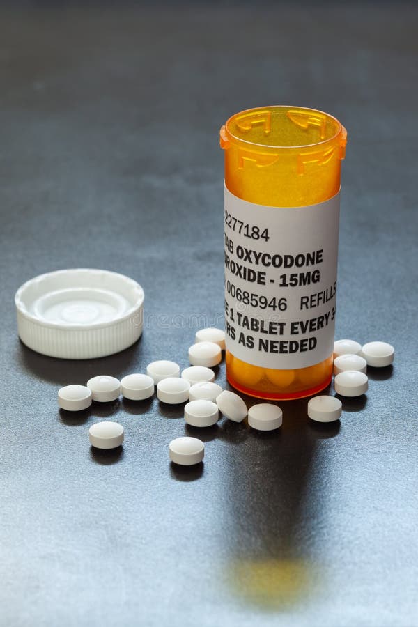 Prescription Bottle with Backlit Oxycodone Tablets. Oxycodone is a ...