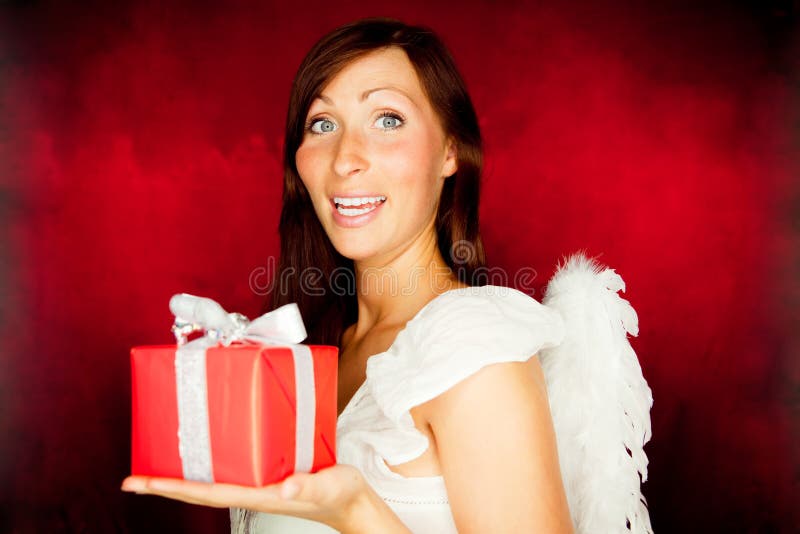Present angel stock image. Image of christmas, people - 16524523