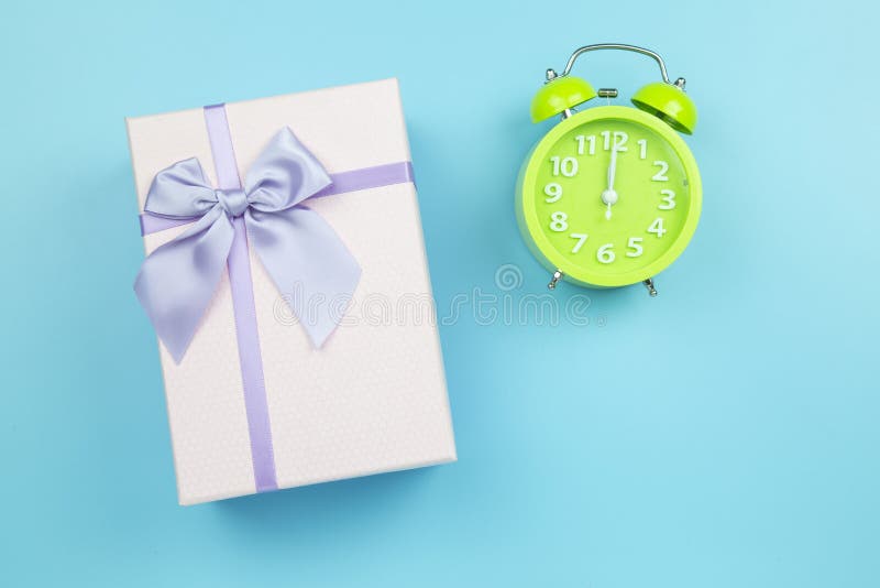 Present Box and Green Clock on Blue Background Pastel Style Copy Stock ...