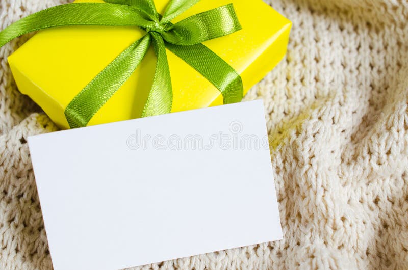Present with Empty Postcard on Beige Knitted Blanket Background. Stock ...