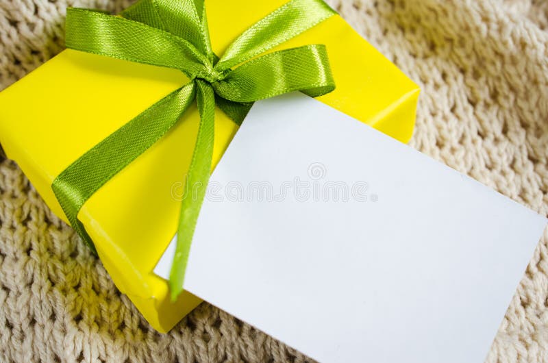 Present with Empty Postcard on Beige Knitted Blanket Background. Stock ...