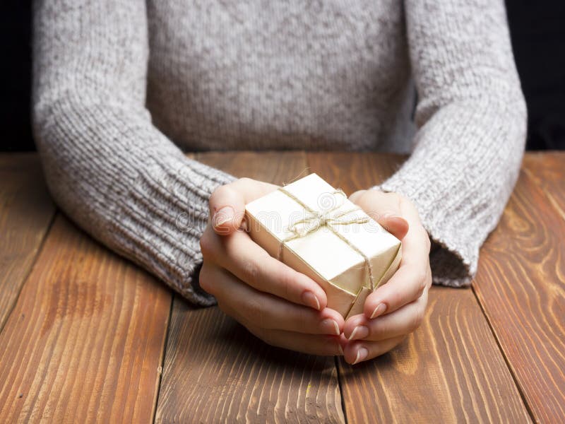 Present, Gift. Close Up of Female Hands Holding Small Gift Stock Photo ... Present, Gift. Close Up of Female Hands Holding Small Gift Stock Photo ...