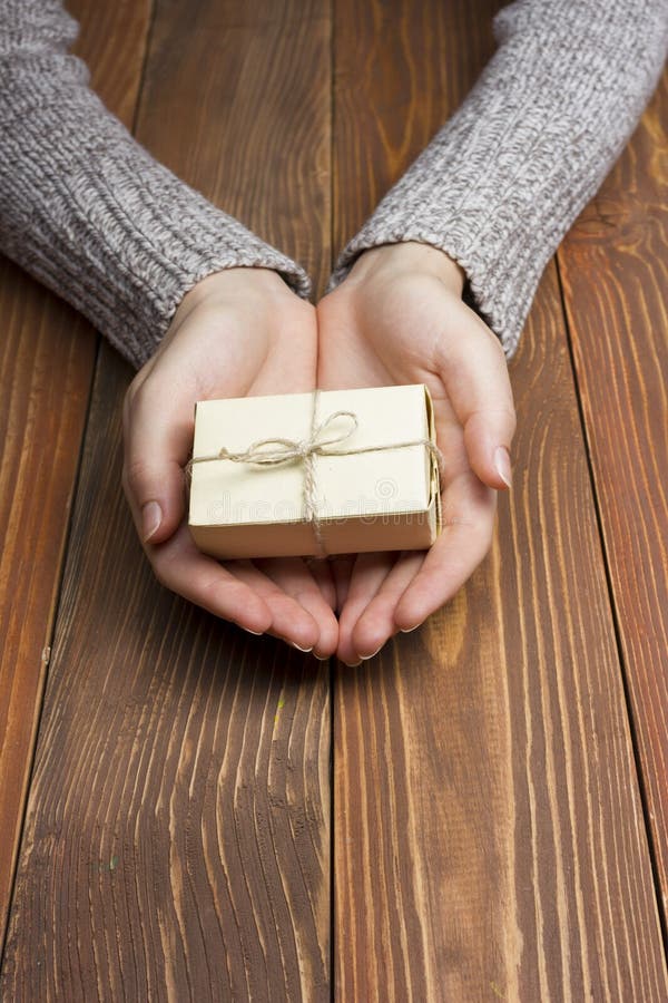 Present, Gift. Close Up of Female Hands Holding Small Gift Stock Photo ...