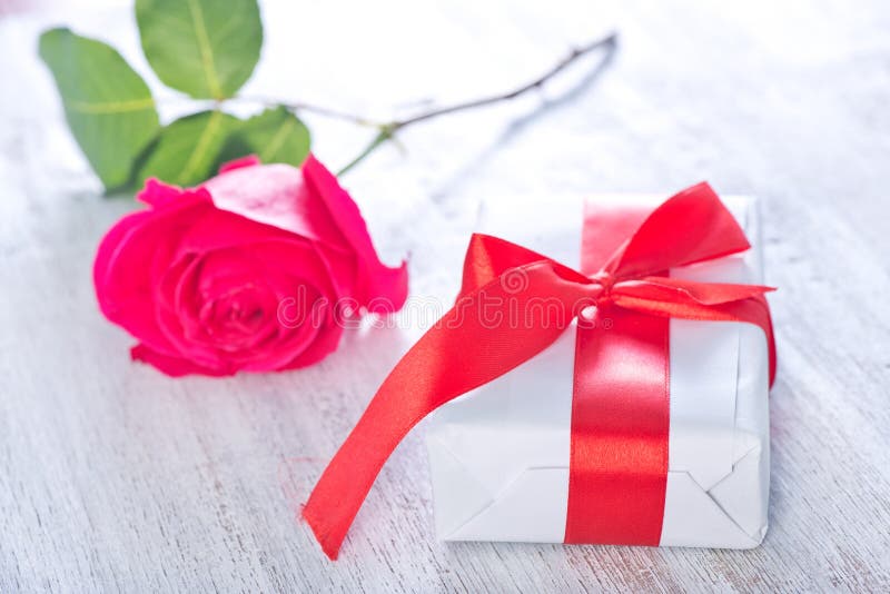 Present and red rose stock image. Image of light, christmas - 60134567