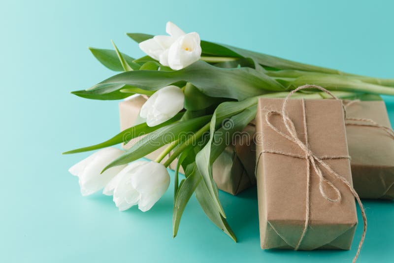 Present of Spring Flowers White Tulips with Gifts Stock Photo - Image ...