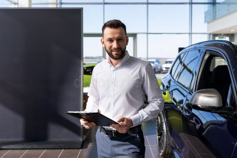 Presentable Car Dealership Manager Next To a Luxury SUV Stock Image ...