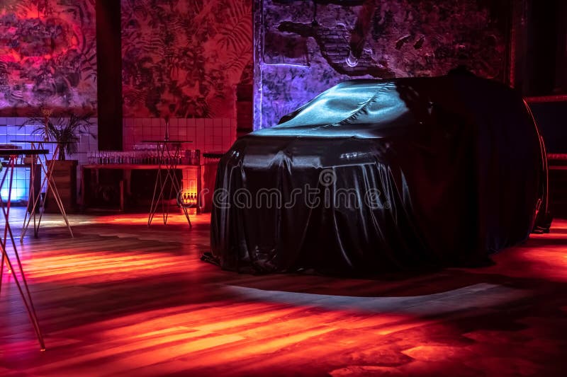 Presentation of a New Car. Unknown Mysterious Car Under a Black Cape ...