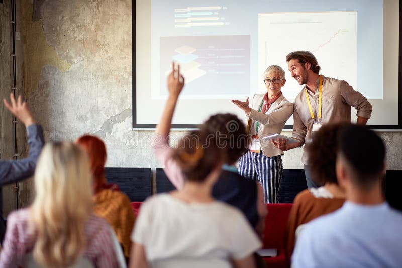 Presentation Participants in the Conference Room are Asking Questions ...