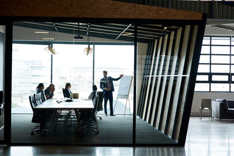 Presentation in Progress. a Group of Executives Having a Meeting in a ... Presentation in Progress. a Group of Executives Having a Meeting in a ...
