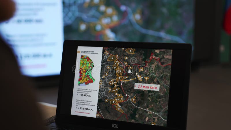 Presenter Shows Map of Specific Area with Various Colors on Computer ...