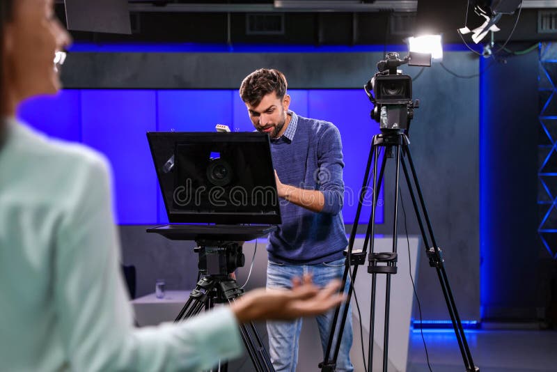 Presenter and Video Camera Operator Working. News Broadcasting Stock ...