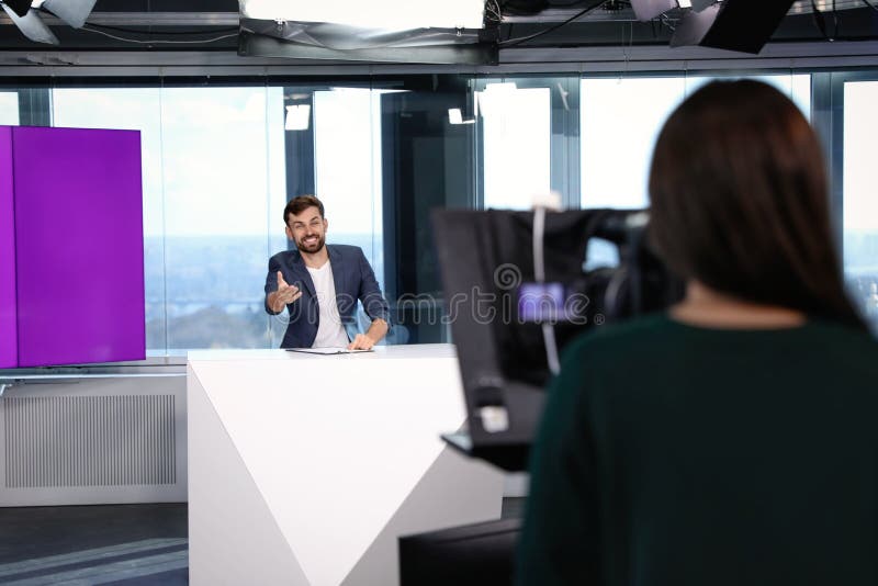Presenter and Video Camera Operator Working. News Broadcasting Stock ...