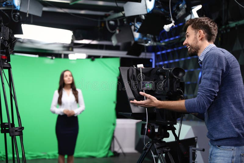 Presenter and Video Camera Operator Working. News Broadcasting Stock ...