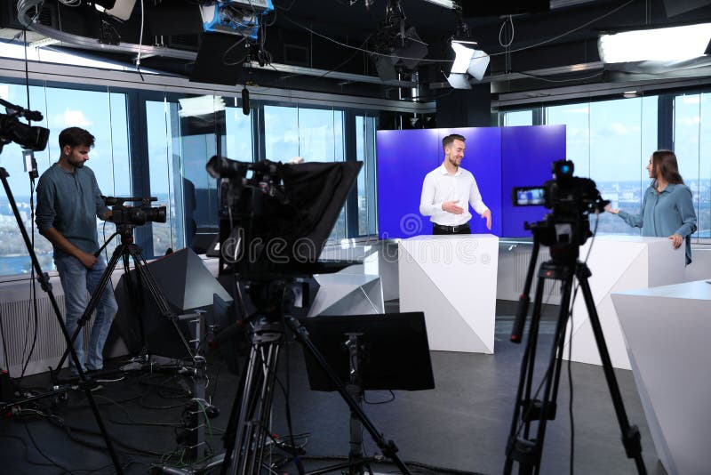 Presenters and Video Camera Operator Working. News Broadcasting Stock ...