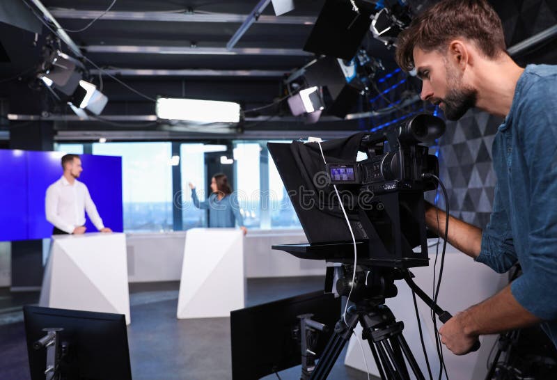 Presenters and Video Camera Operator Working. News Broadcasting Stock ...