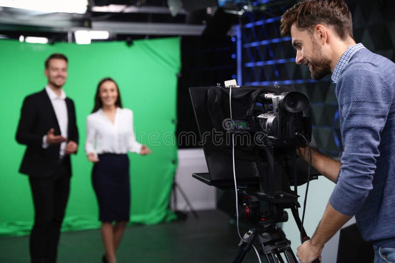 Presenters and Video Camera Operator Working in Studio Stock Photo ...