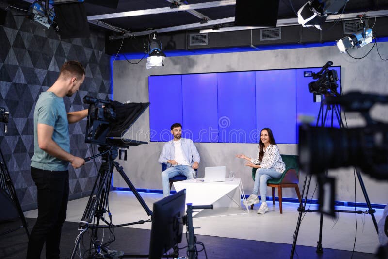Presenters and Video Camera Operator Working. News Broadcasting Stock ...