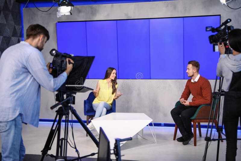 Presenters and Video Camera Operator Working in Studio Stock Photo ...