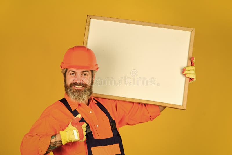 Presenting Flip-chart at Meeting. Male Construction Worker. Copy Space ...