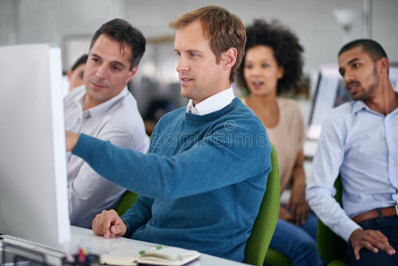 Presenting Ideas in the Tech Age. a Group of Creative Businesspeople ...