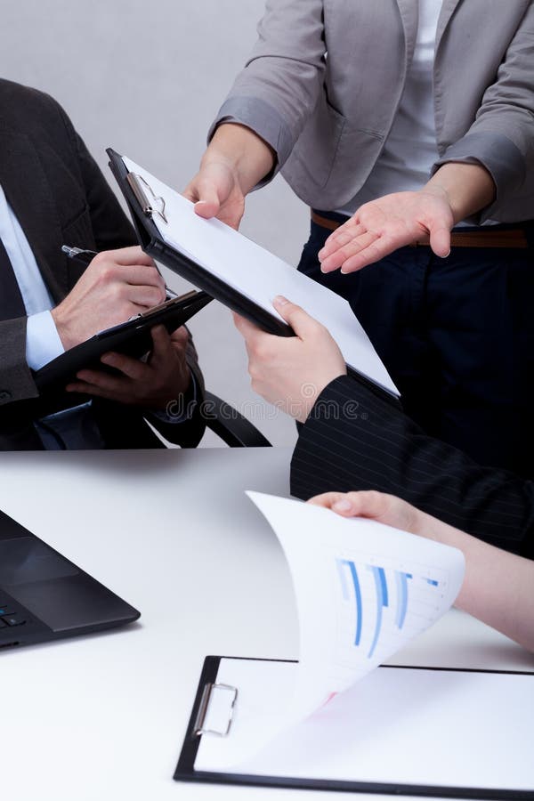 Presenting Notes on a Meeting Stock Photo - Image of businesswoman ...