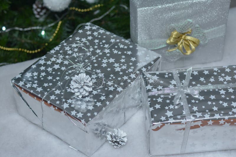 Presents in Silver Packing with Stars and Bows Stock Photo - Image of ...