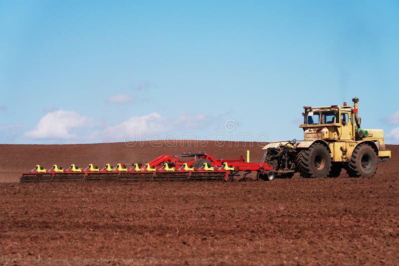 Presowing Tillage. Tractor with Trailed Combination Cultivator in the ...