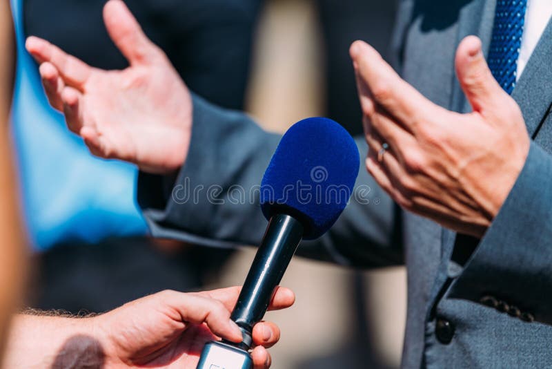 Press interview outdoors stock image. Image of speech - 269861731