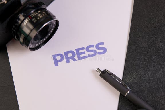 Press Materials on Desk with Camera and Pen Ready for Use Stock Photo - Image of assignment ...