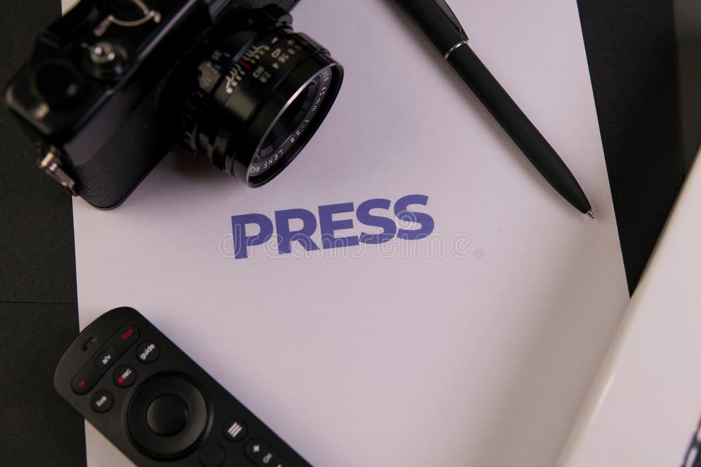 Press Materials on a Desk with Camera and Remote Control Stock Image - Image of control, office ...