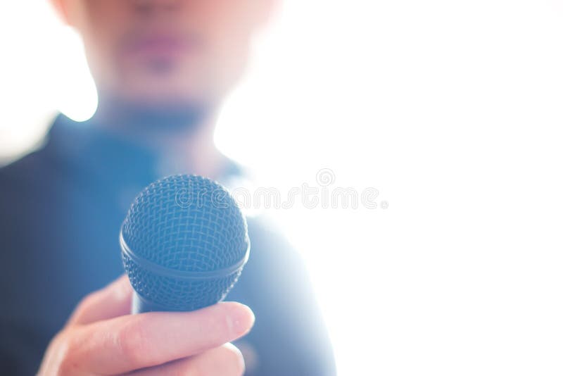 Press Officer is Speaking into a Microphone and Giving an Interview ...