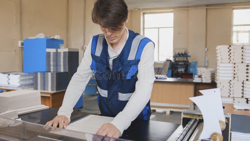 The Operator of the Printing House Works at the Typographical Machine ...