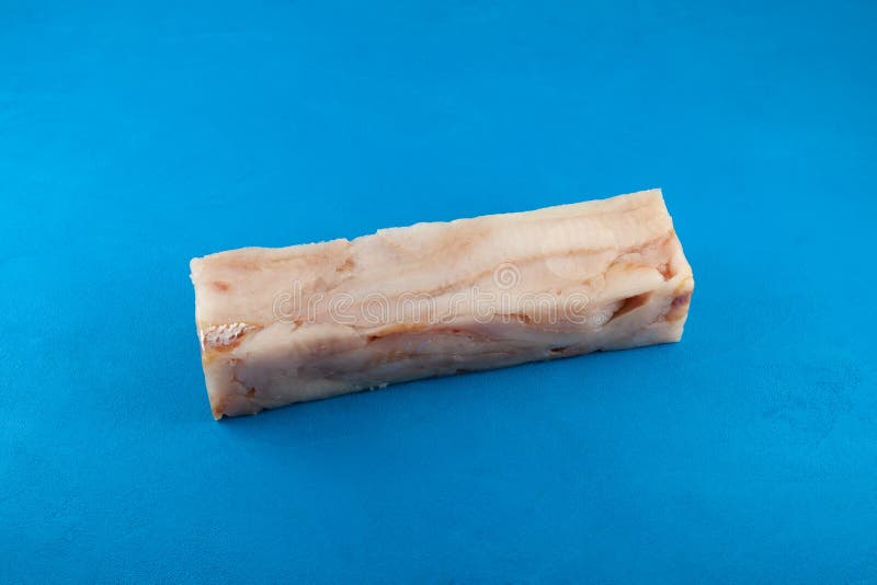 Pressed Frozen Fish Fillet on Blue Background. Proper Slow Defrosting ...