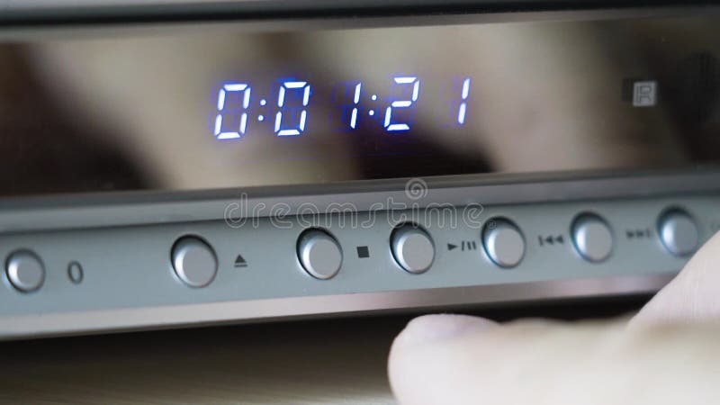 Pressing the Button on the Control Panel of the DVD Player with Your ...