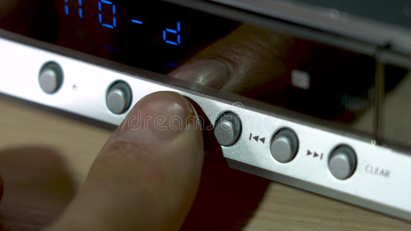 Pressing the Button on the Control Panel of the DVD Player with Your ...